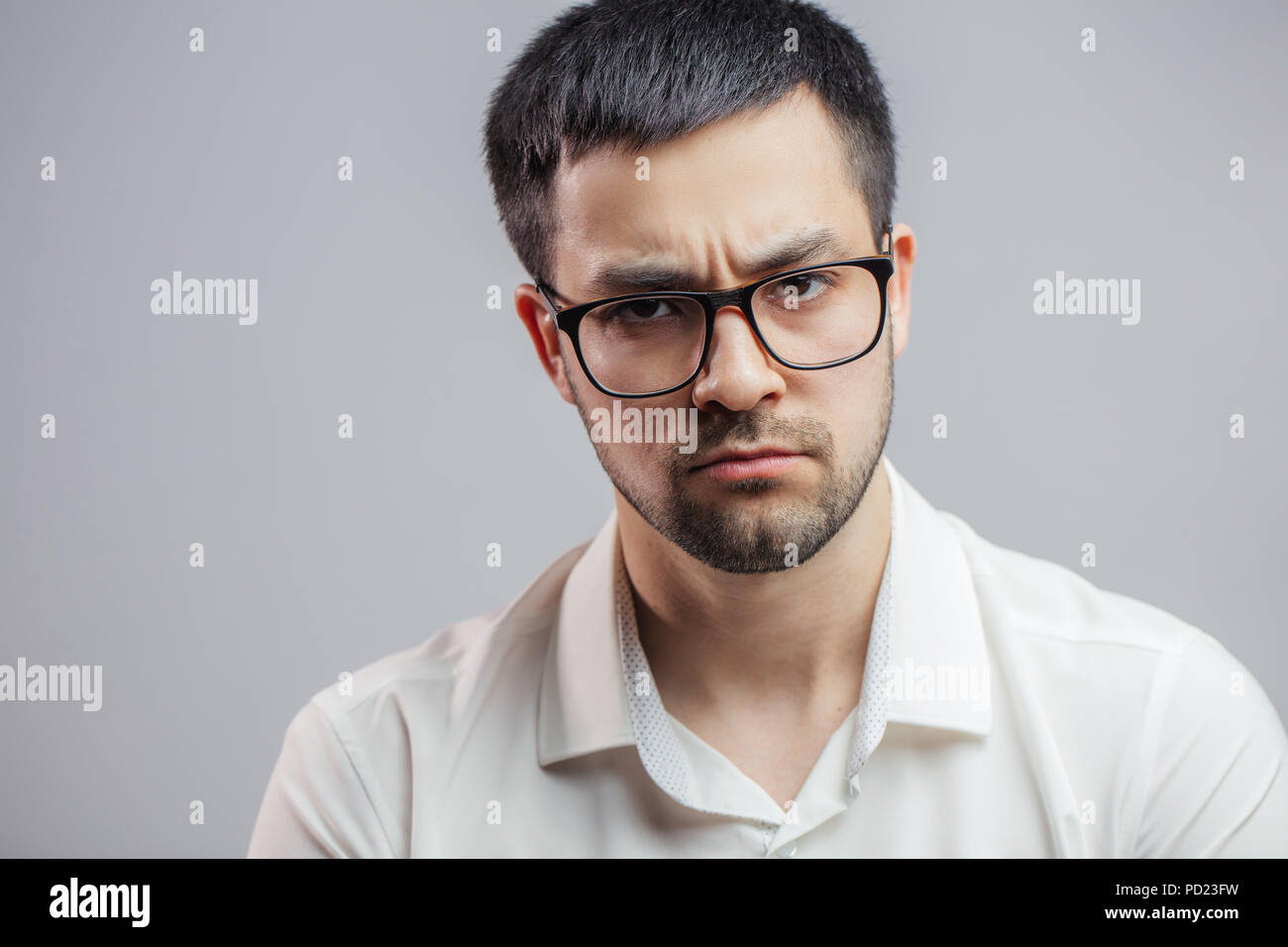 pensive gloomy young man being upset because of bad news. angry ...