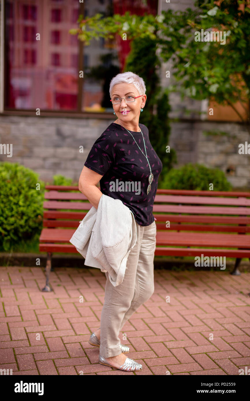 side view full length photo. attractive gorgeous woman holding her ...