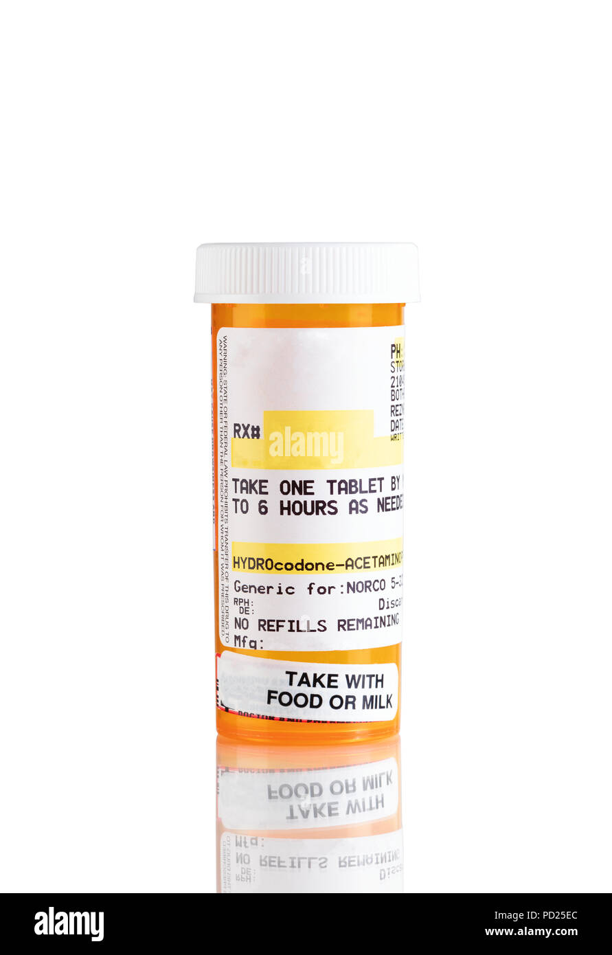 Macro of opioid tablets in bottle isolated on white background with ...