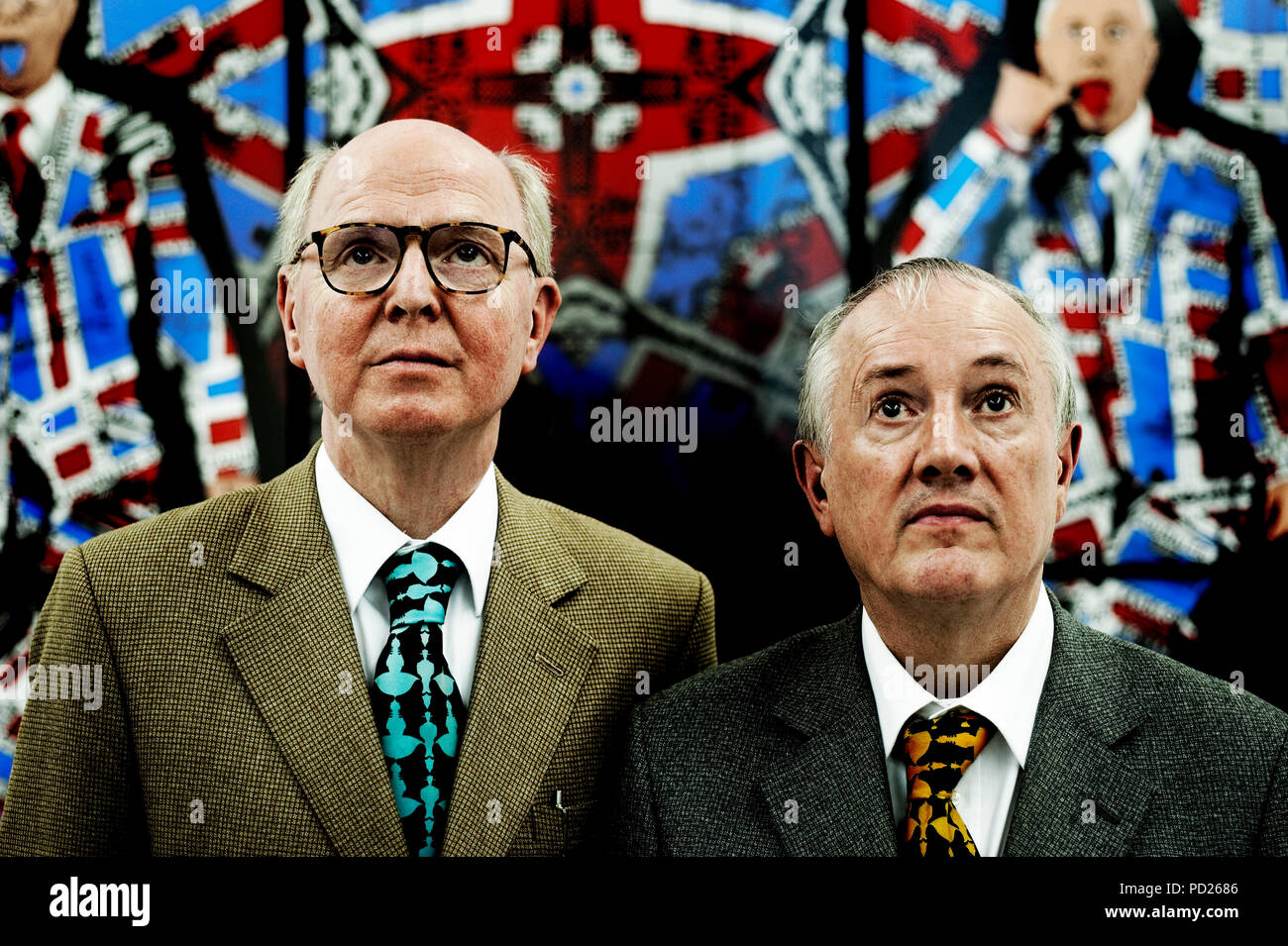 British contemporary artists Gilbert and George posing in the Baronian ...