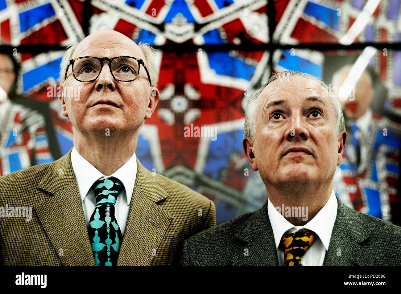 British contemporary artists Gilbert and George posing in the Baronian ...