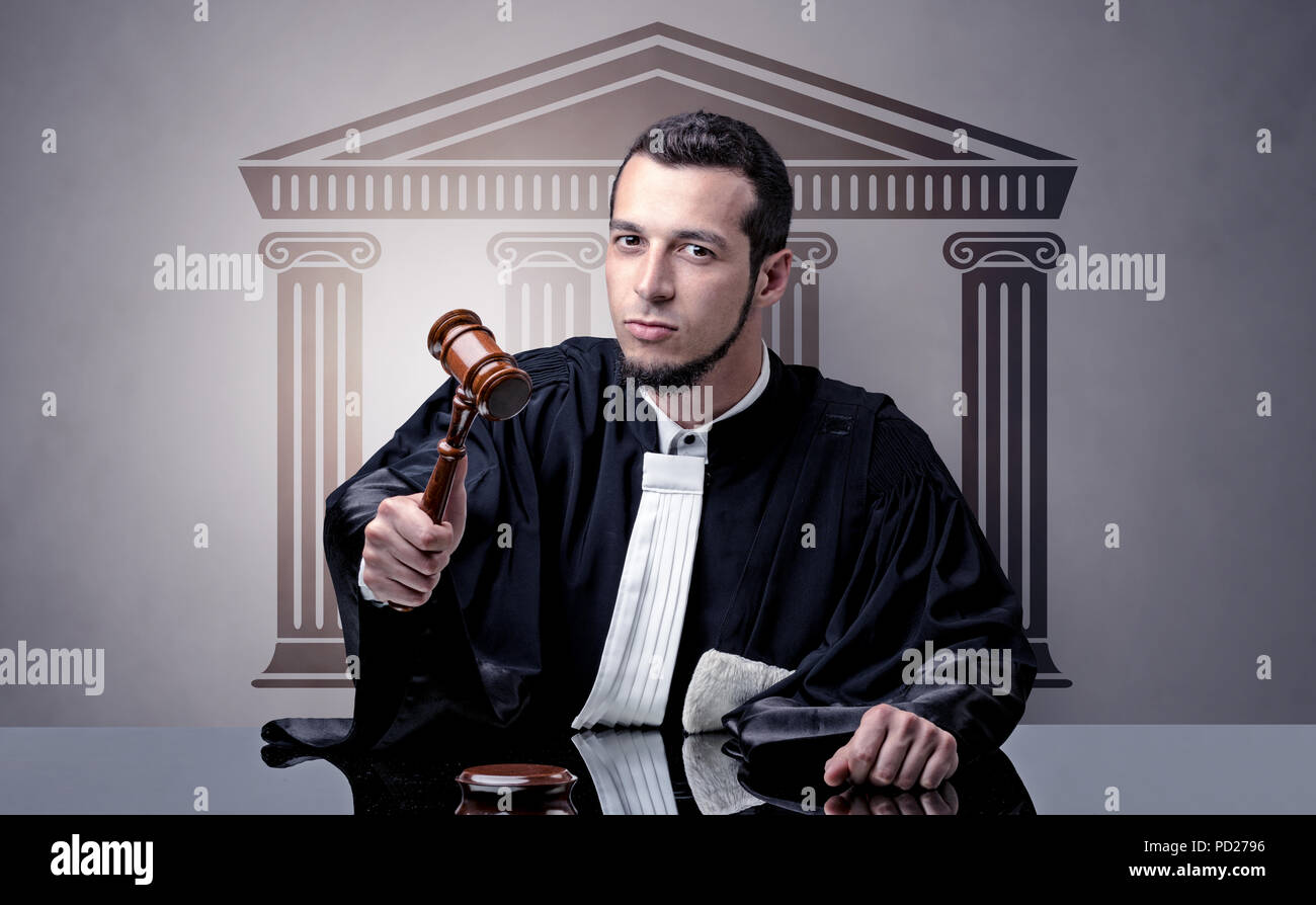 Young judge in front of a courthouse symbol making decision Stock Photo ...