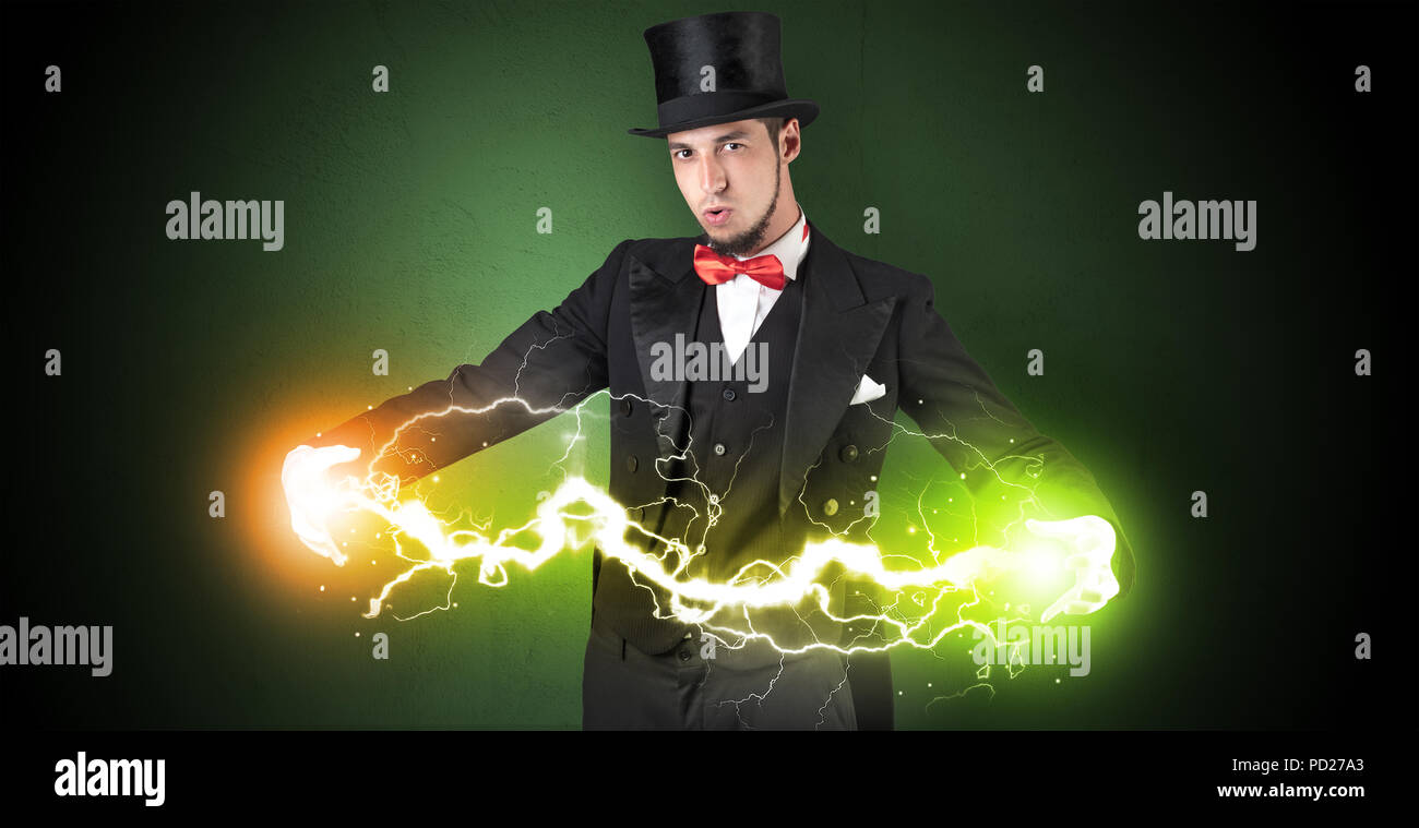 Magician sparkling super power between his two hands Stock Photo - Alamy