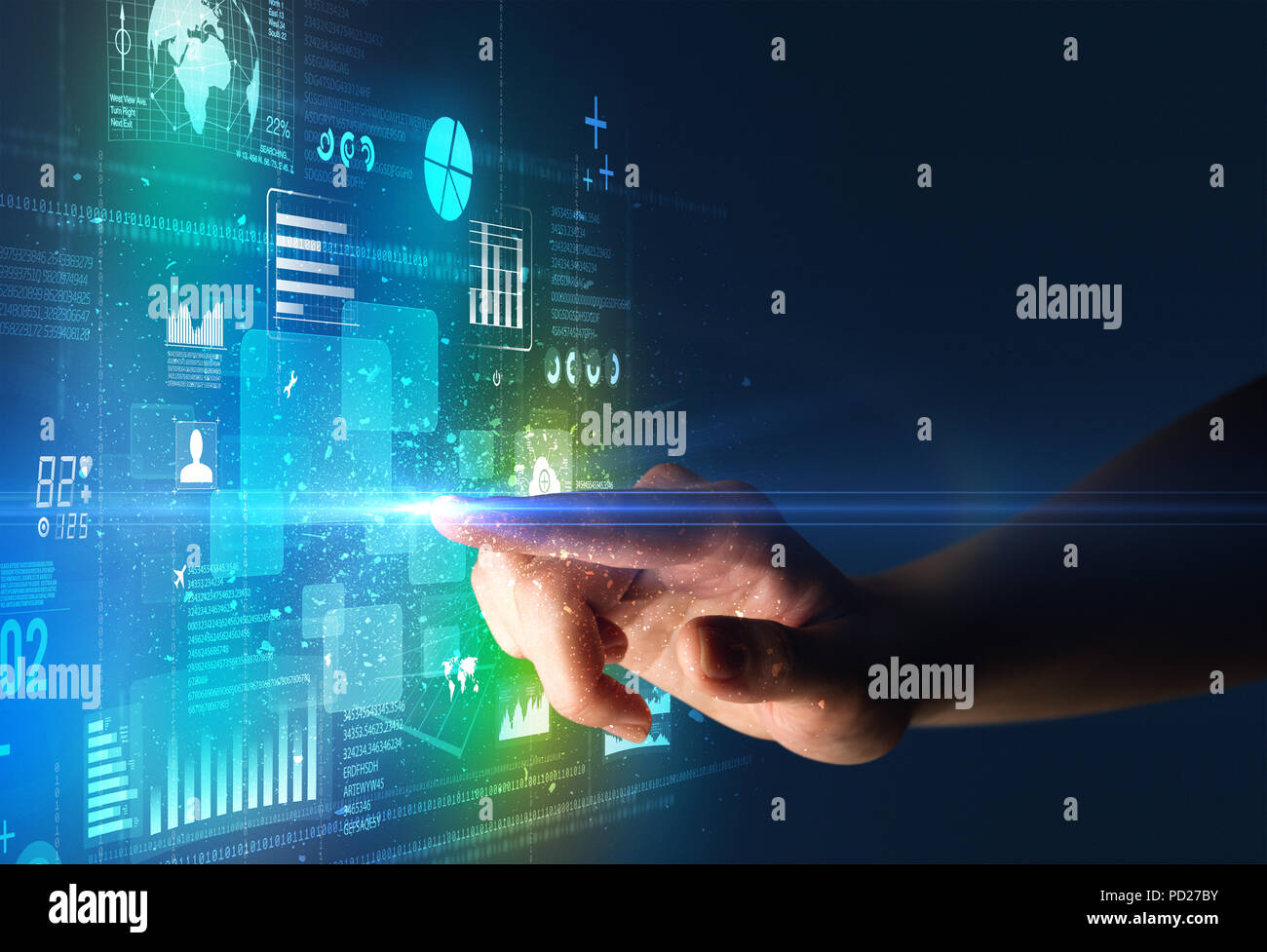 Female finger touching a beam of light surrounded by blue and green ...