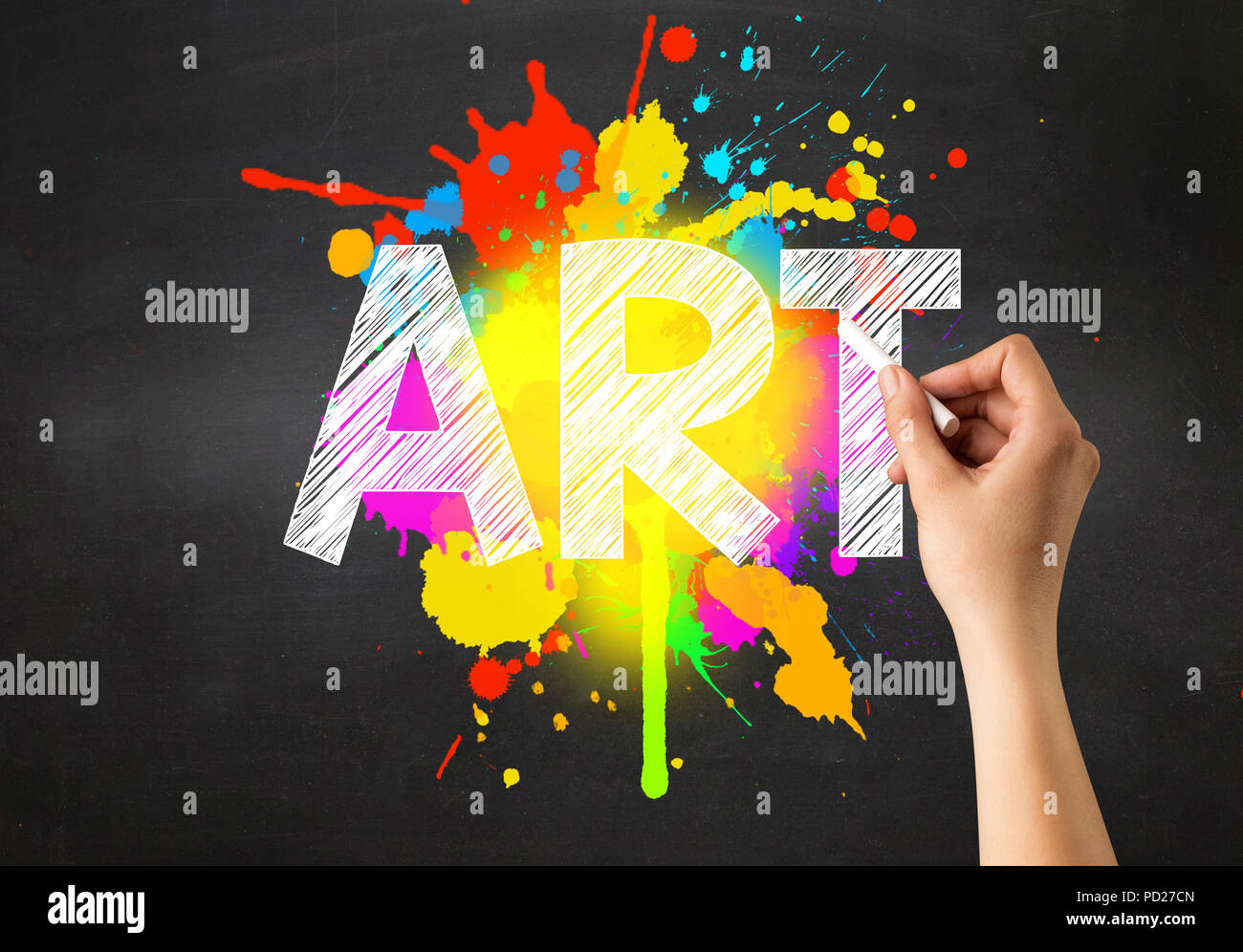 Female hand holding white chalk in front of a blackboard with art ...