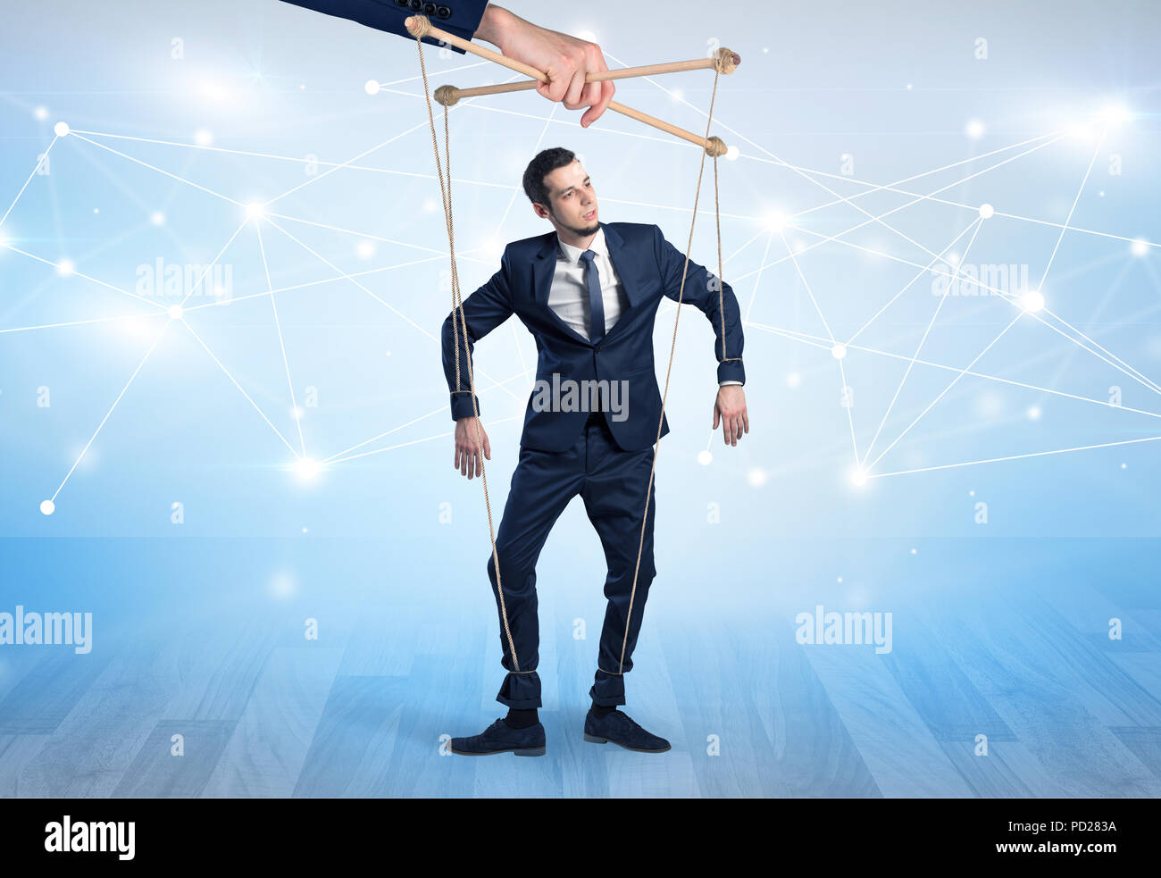 Puppet businessman controlled by another hand with financial concept ...