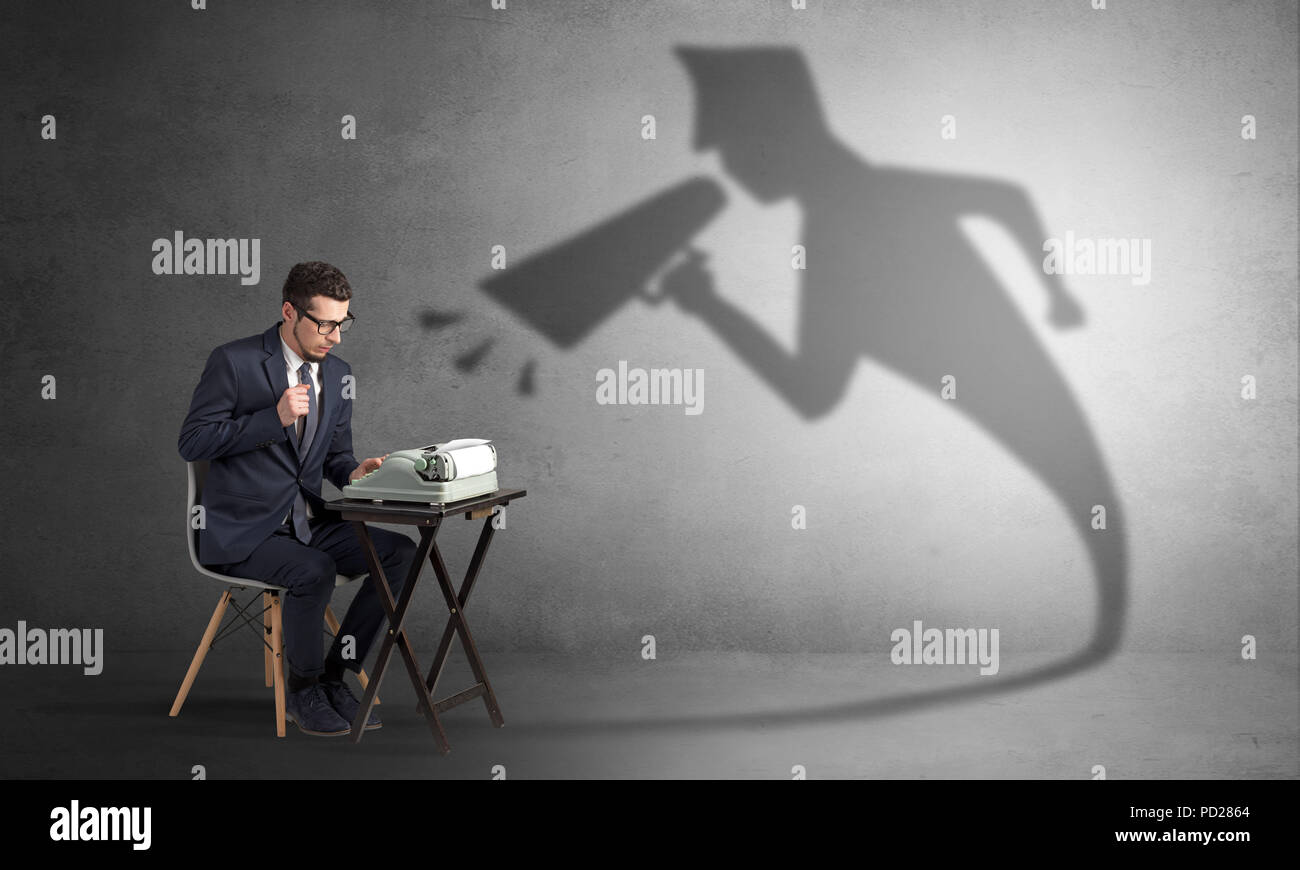 Hard working businessman shadow yelling to himself concept Stock Photo ...
