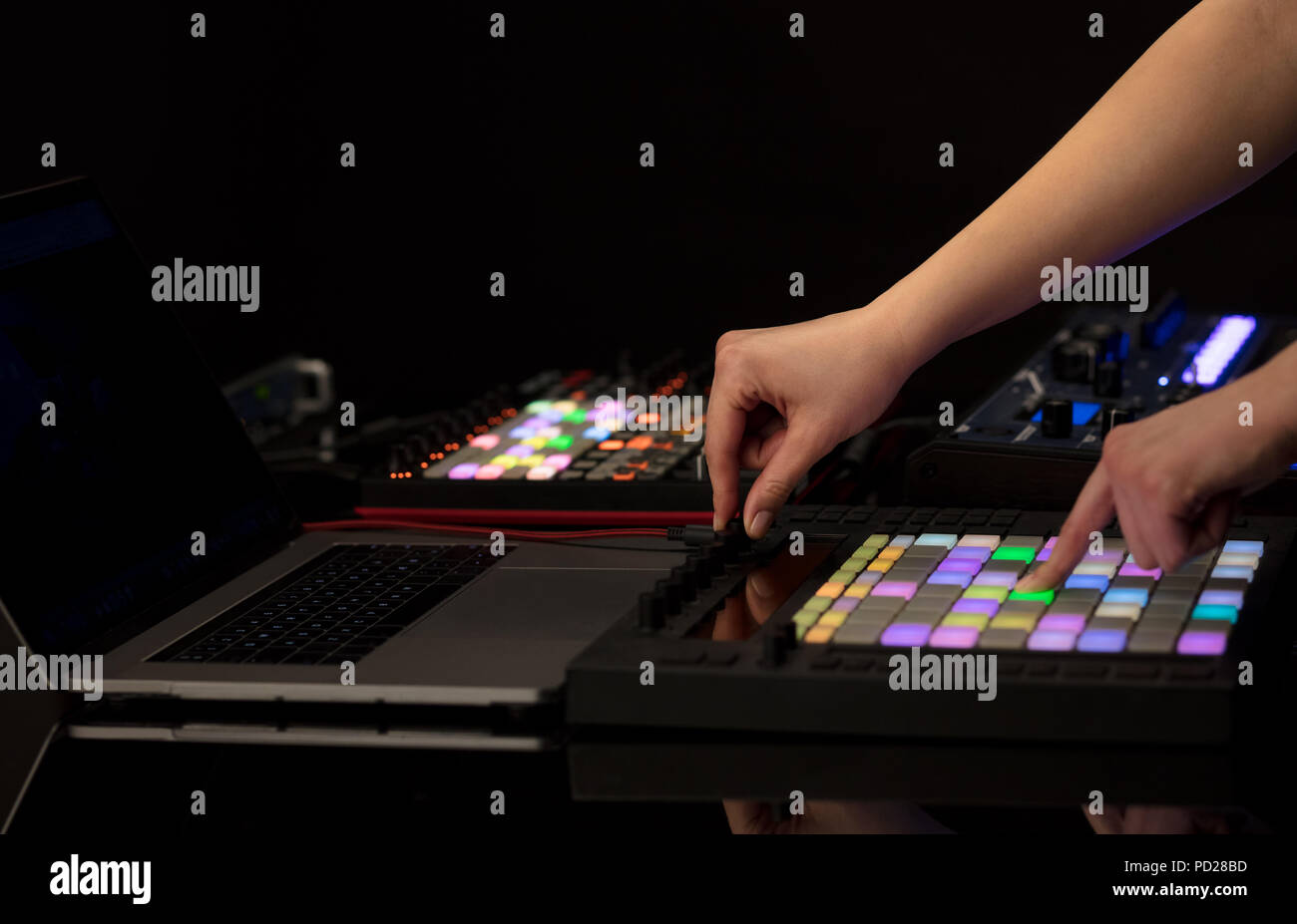 Dj hand remixing music on midi controller Stock Photo - Alamy