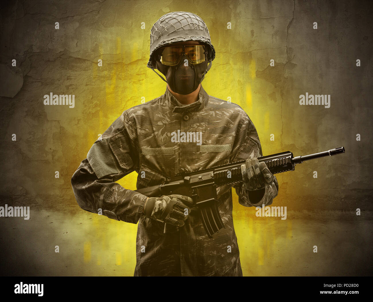 Hazard, menace soldier in a ruined crumbly building with arms on his ...