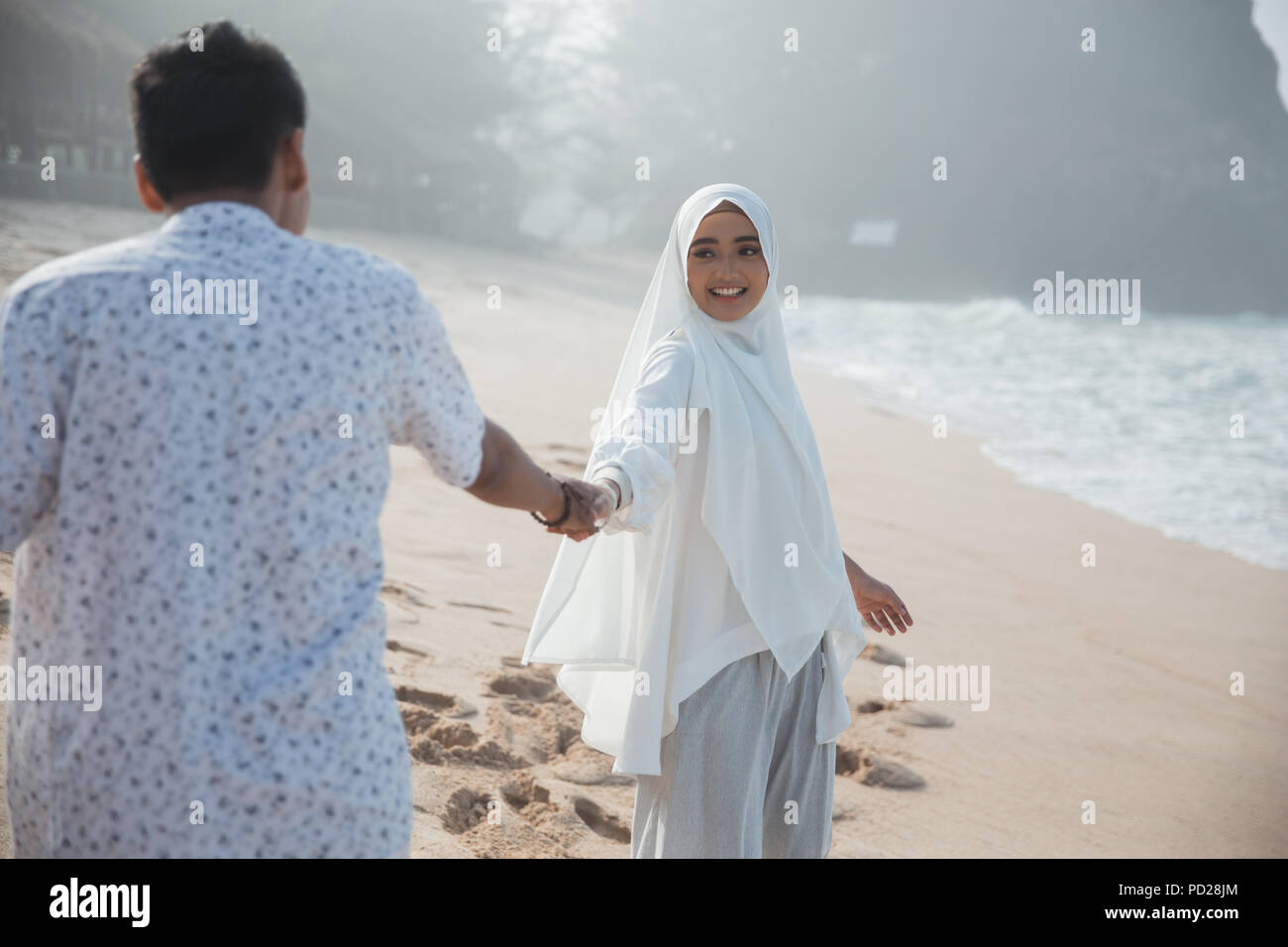romantic muslim couple holding hand Stock Photo - Alamy