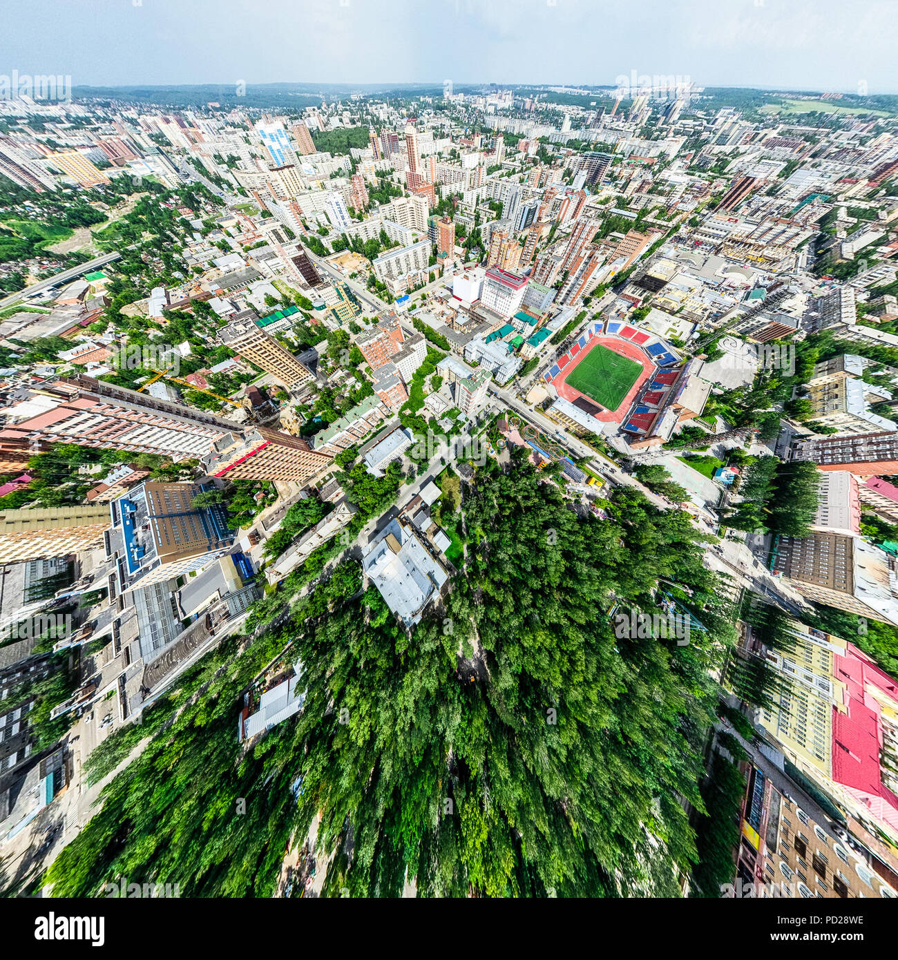 Aerial city view with crossroads and roads, houses, buildings, parks ...