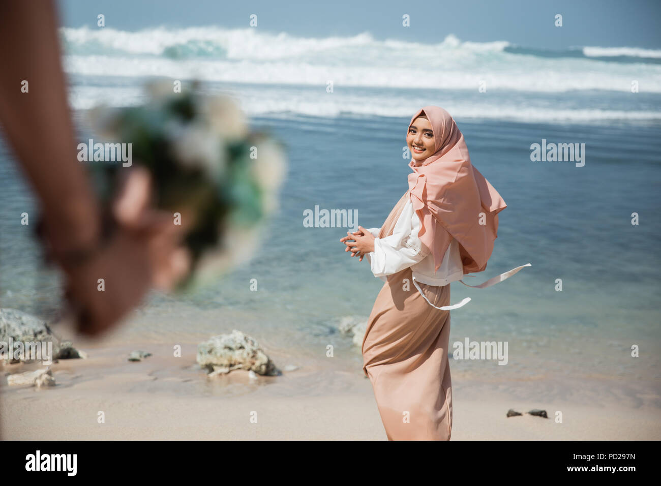 muslim woman surprised of getting a flower Stock Photo - Alamy