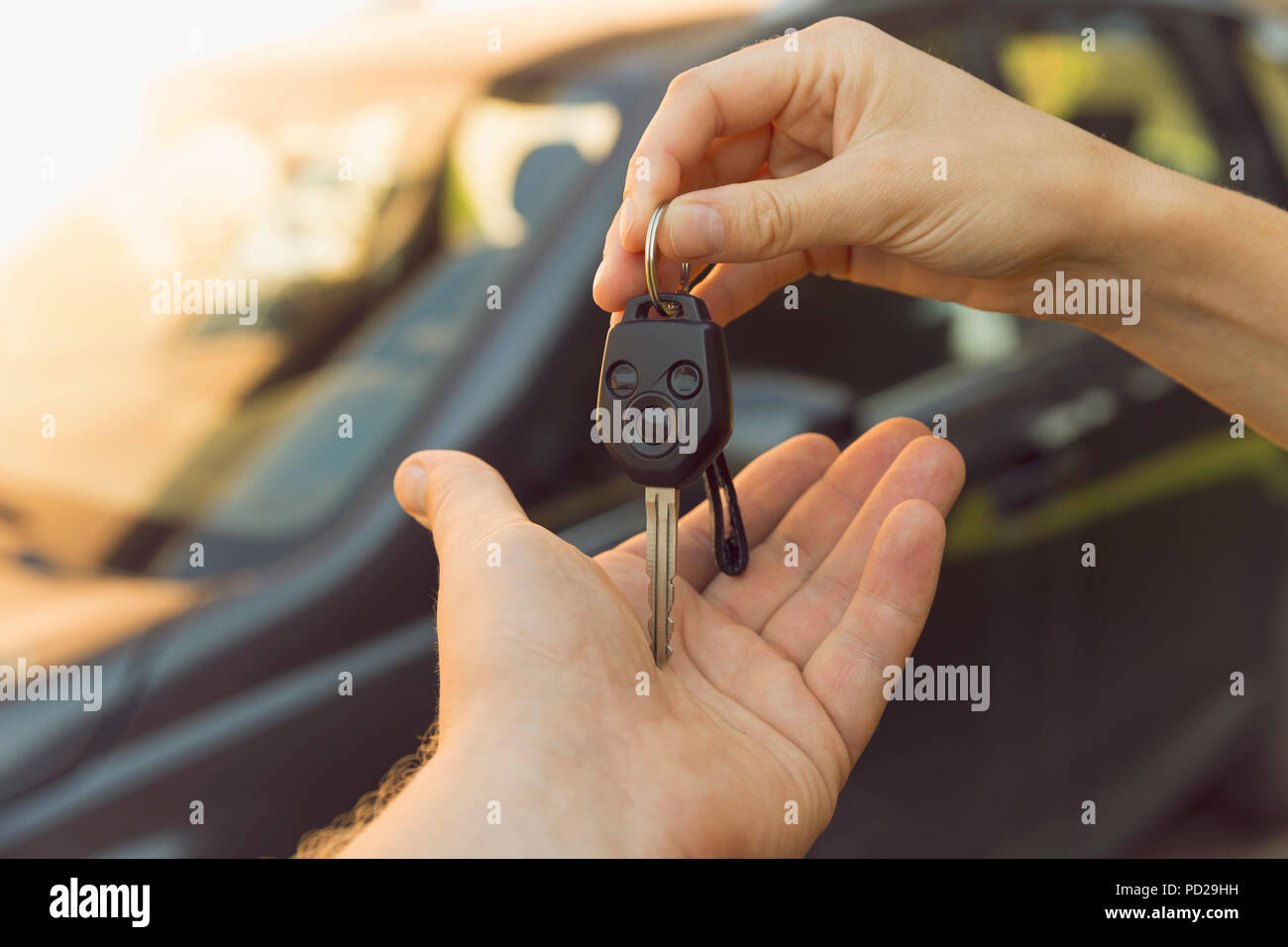 Handing key cars hi-res stock photography and images - Alamy
