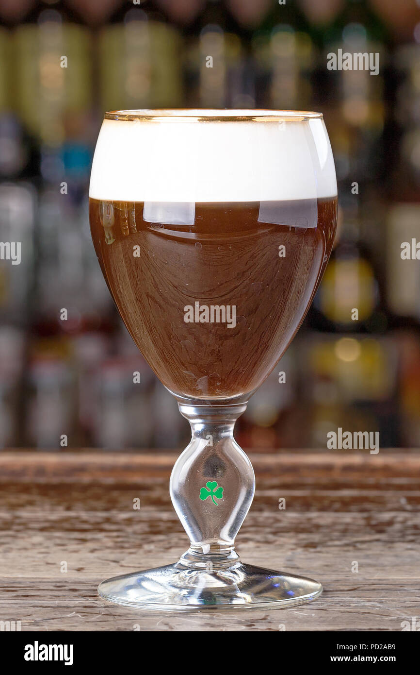 Irish coffee in the bar on the bar. Alcoholic coffee cocktail with ...