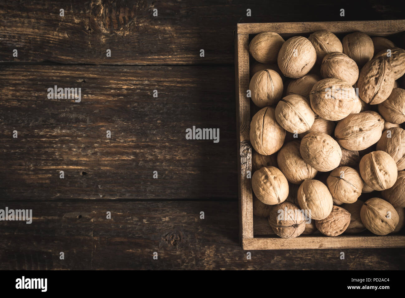 Organic Walnuts in rustic wooden box, top view. Seasonal harvest of ...