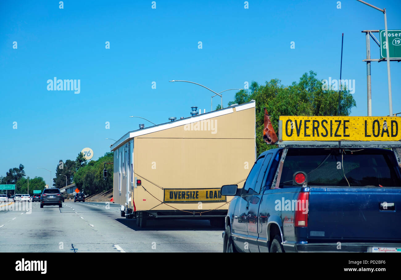 Los Angeles, MAY 21: Oversize car loaded with Tiny home driving in the ...
