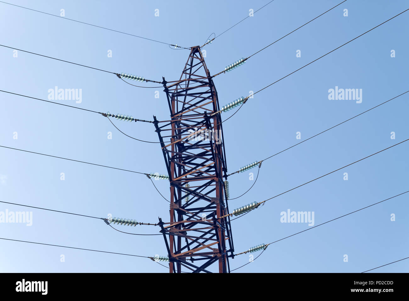 Electric pylon against the backdrop of the blue sky on a summer day ...
