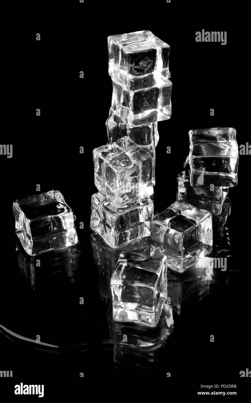 stack of ice cubes on black background Stock Photo - Alamy