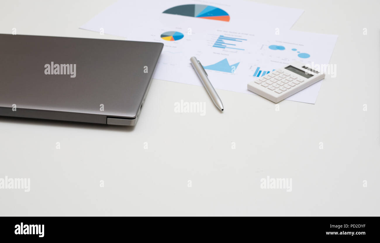 office table desk. Workspace with laptop, diary, calculator and ...