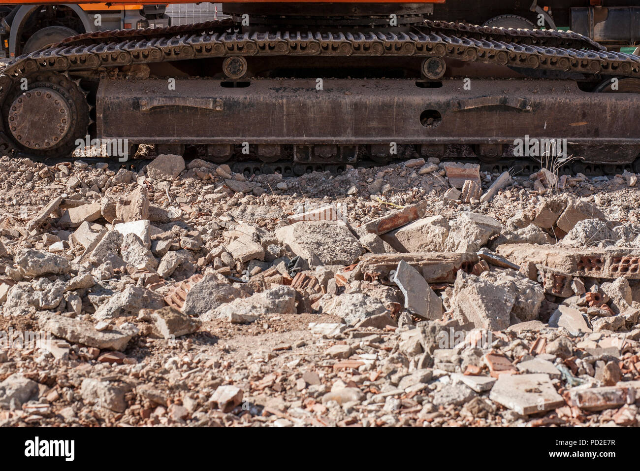 Tracks of excavator over loads of rubble debris. Construction site ...