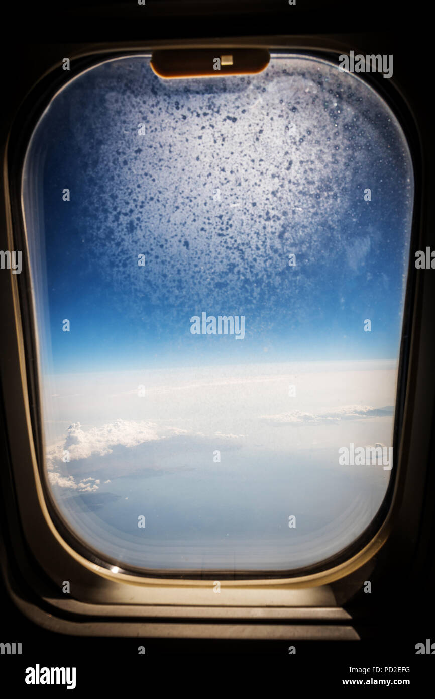 Aerial view from airplane dirty window with the sky and cloud Stock ...