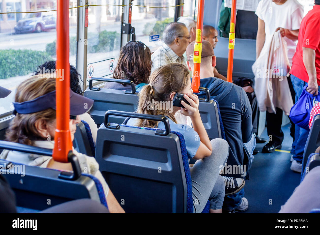 Commuters checking cell phones hi-res stock photography and images - Alamy
