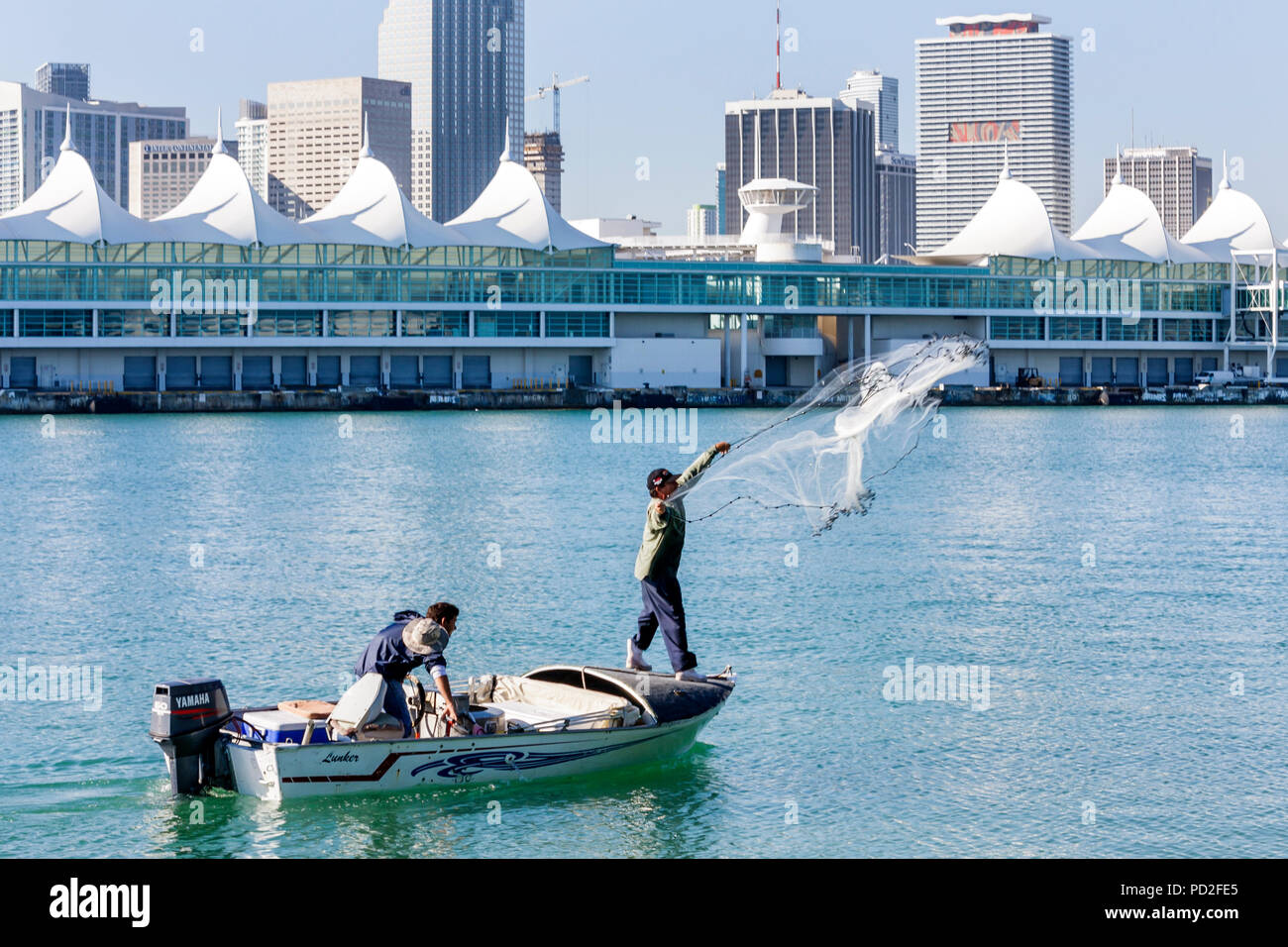 Man throwing fishing net in hi-res stock photography and images - Alamy