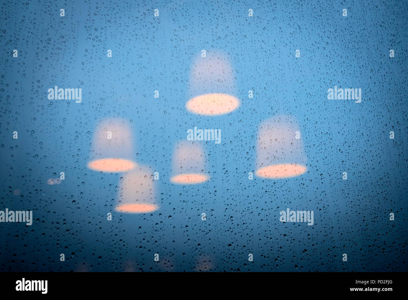 Drops of rain on window with abstract lights Stock Photo - Alamy