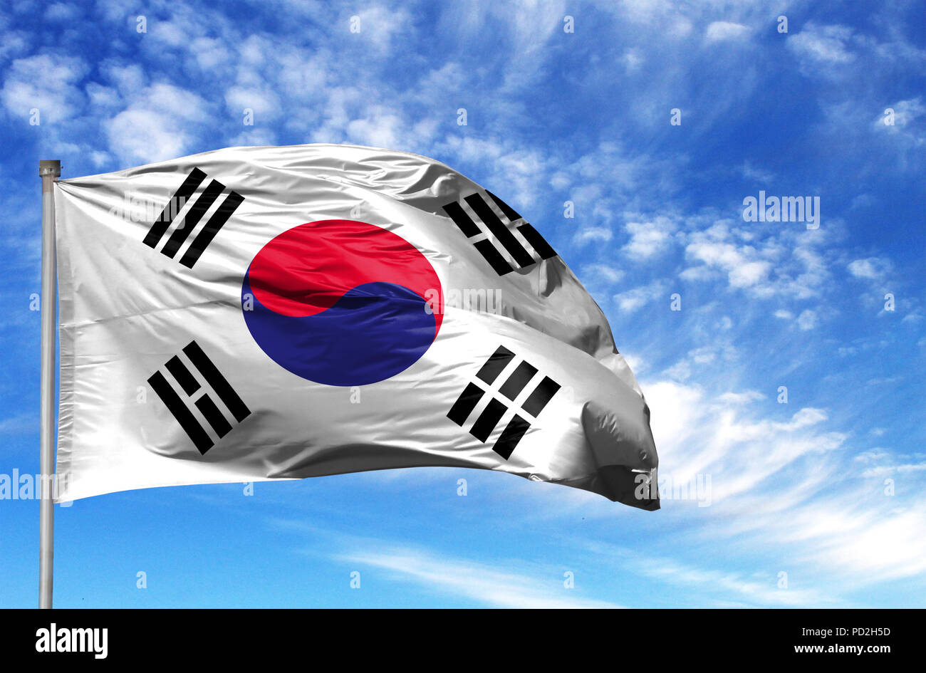 National flag of South Korea on a flagpole in front of blue sky Stock ...