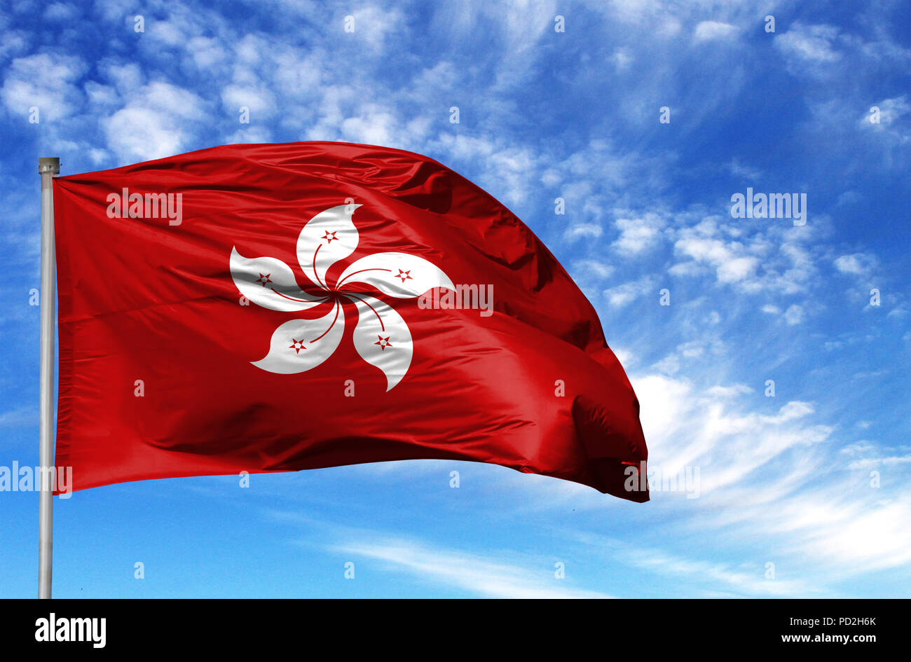 National flag of Hong Kong on a flagpole in front of blue sky Stock ...