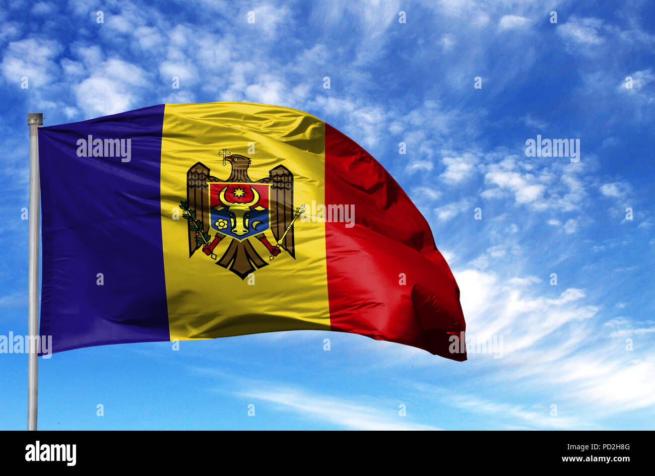 National flag of Moldova on a flagpole in front of blue sky Stock Photo ...