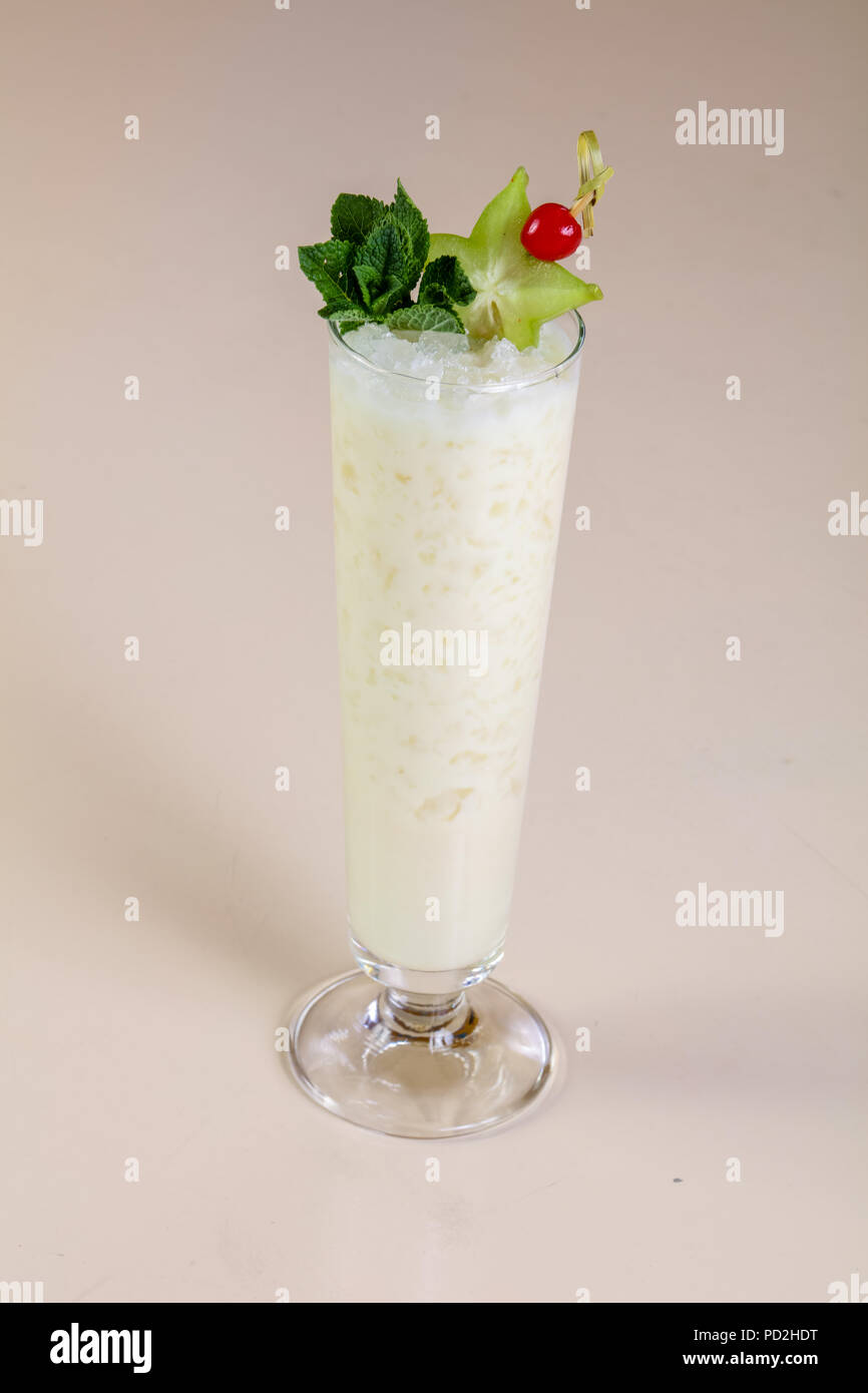 Pina colada coconut coctail with mint Stock Photo - Alamy