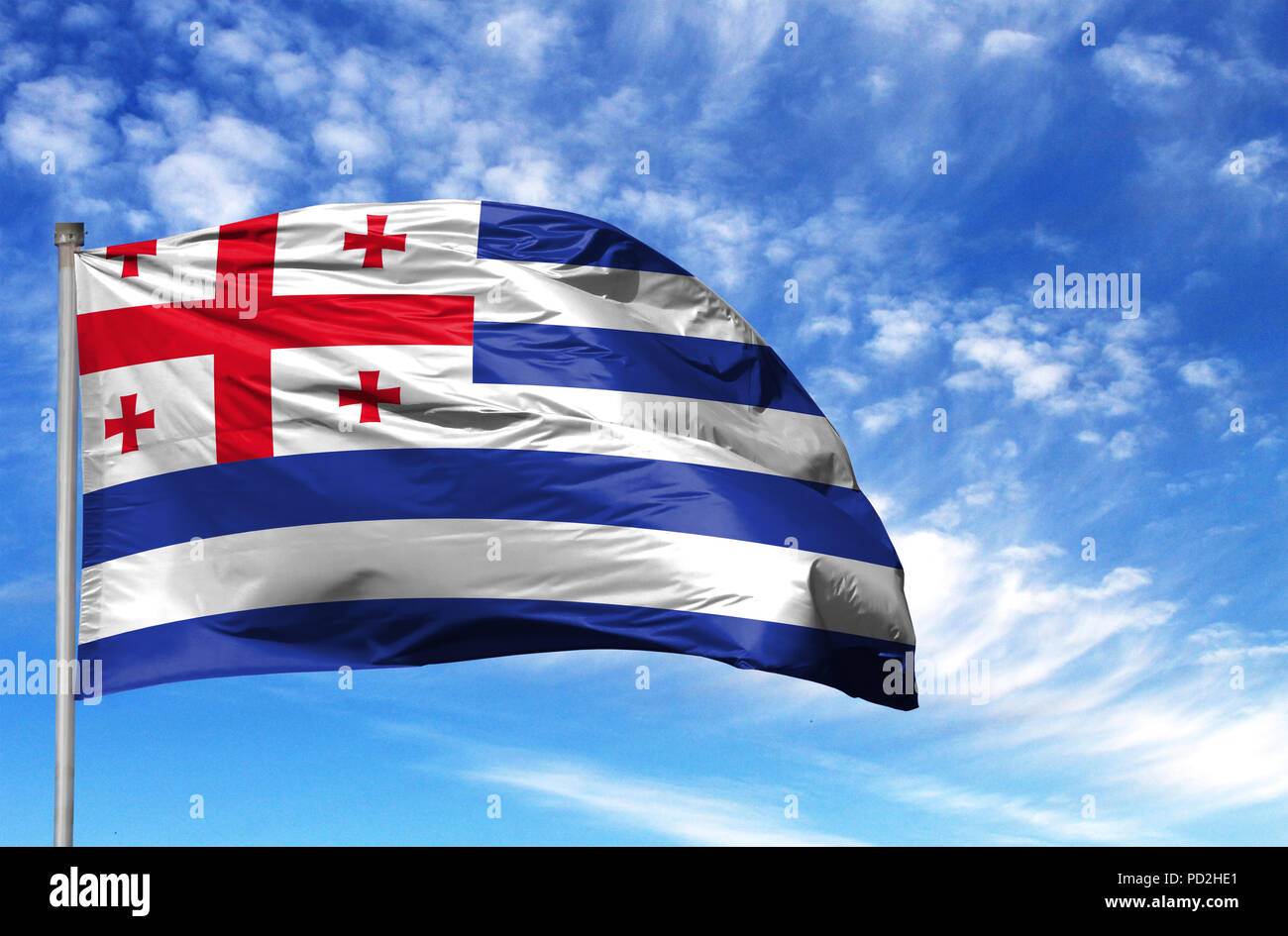 National flag of Adjara on a flagpole in front of blue sky Stock Photo ...