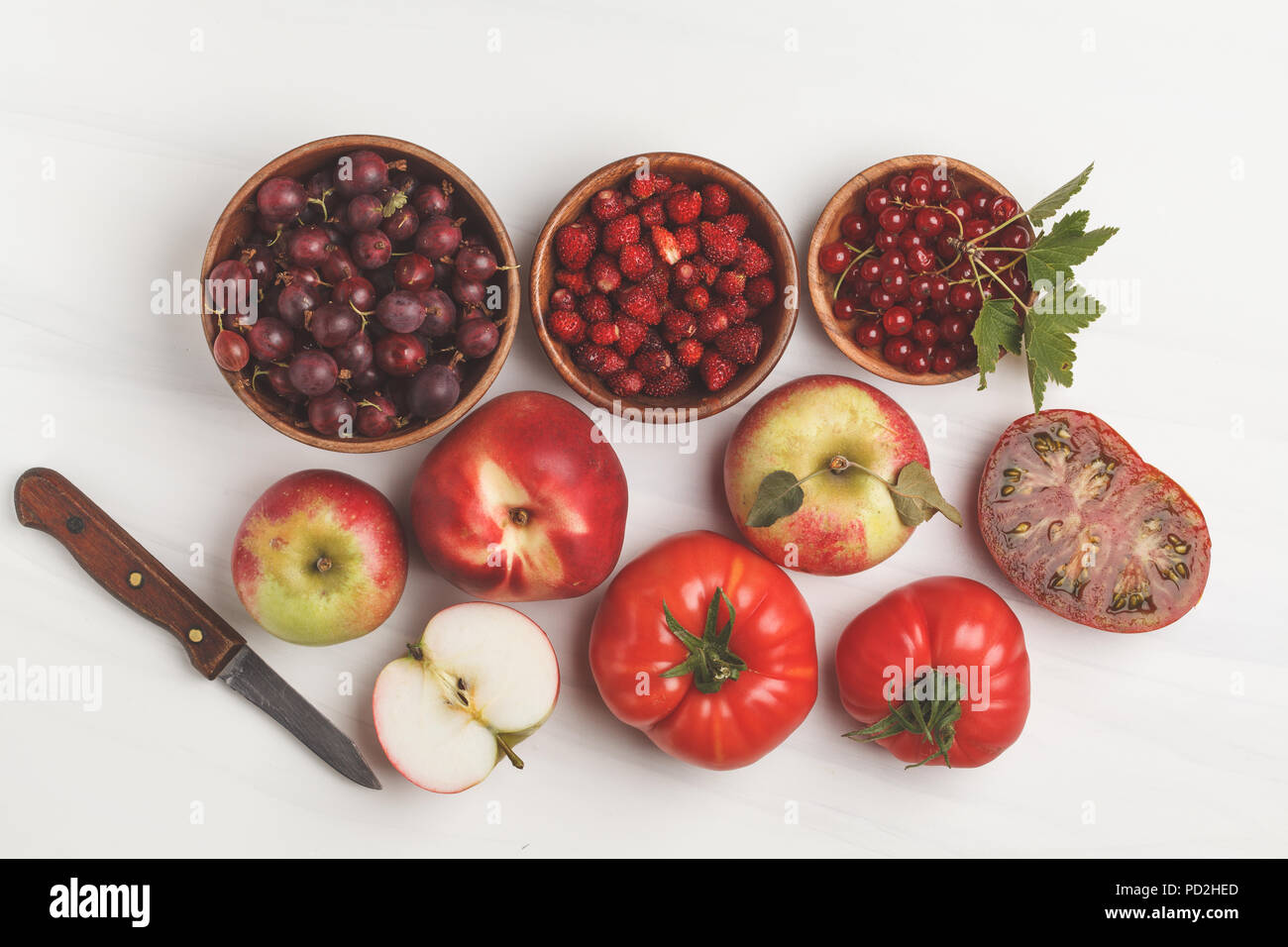 Assortment of red foods on a white background, top view. Fruits and ...