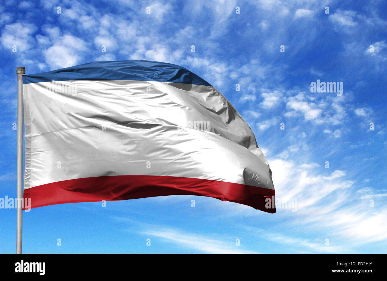 National flag of Crimea on a flagpole in front of blue sky Stock Photo ...