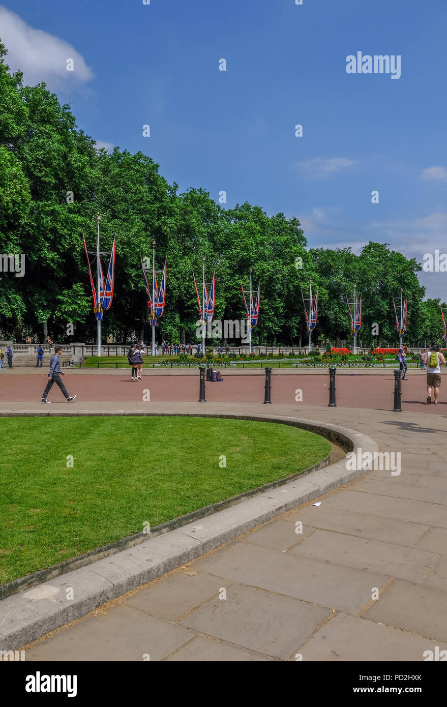 The Mall, London, UK - June 8, 2018: Vertical shot of flag poles with ...