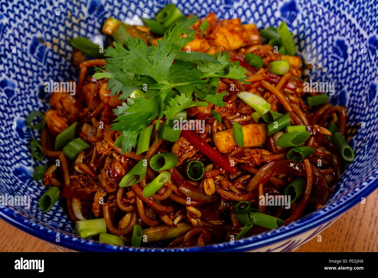Wok Stir fry noodle with chicken Stock Photo - Alamy