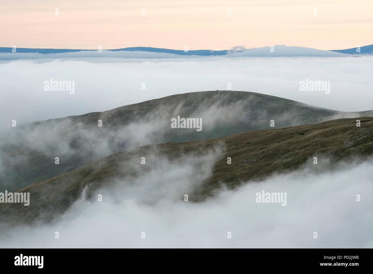 Hill tops and mountains emerging from cloud inversion near Haweswater ...