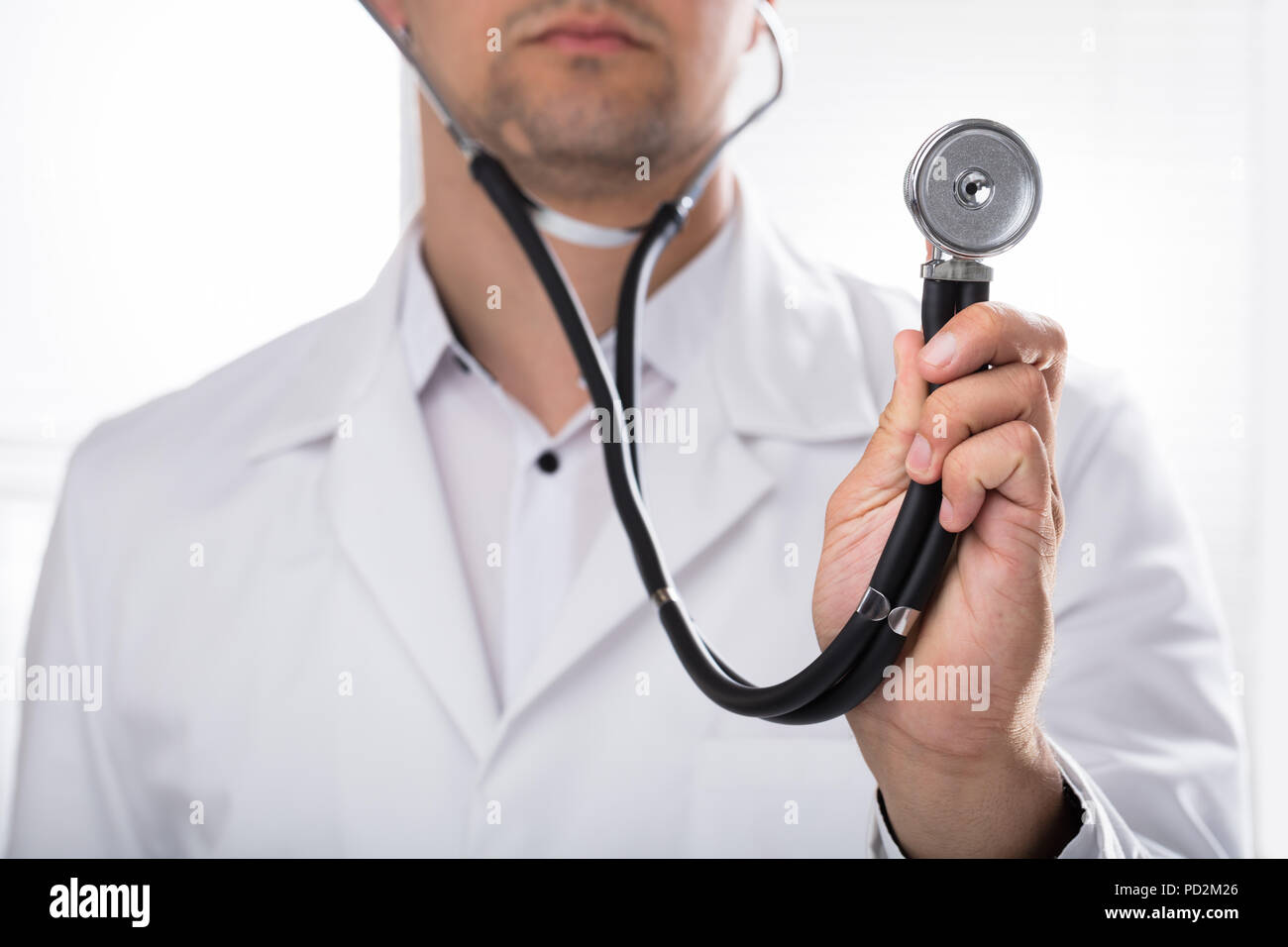 Doctors hand holding a stethoscope hi-res stock photography and images ...