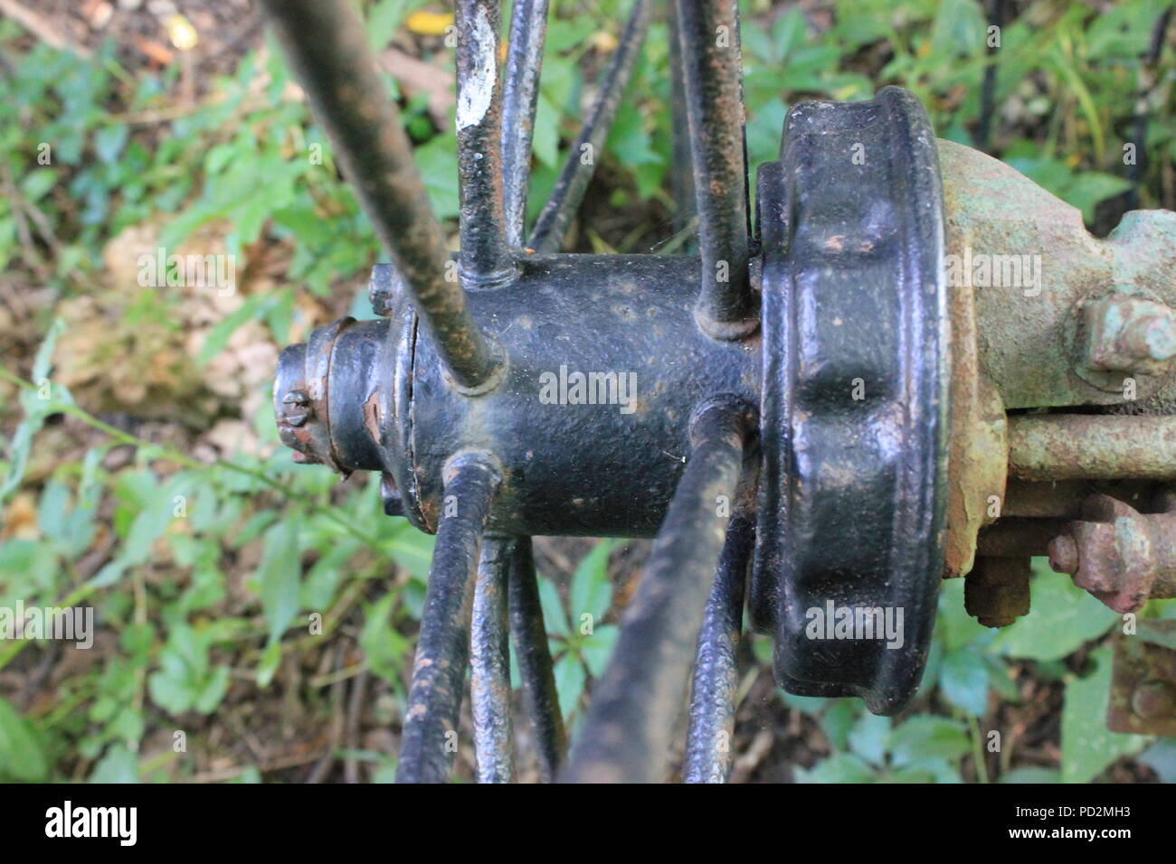 Forged iron wheel axle on a bright sunny summer day Stock Photo - Alamy