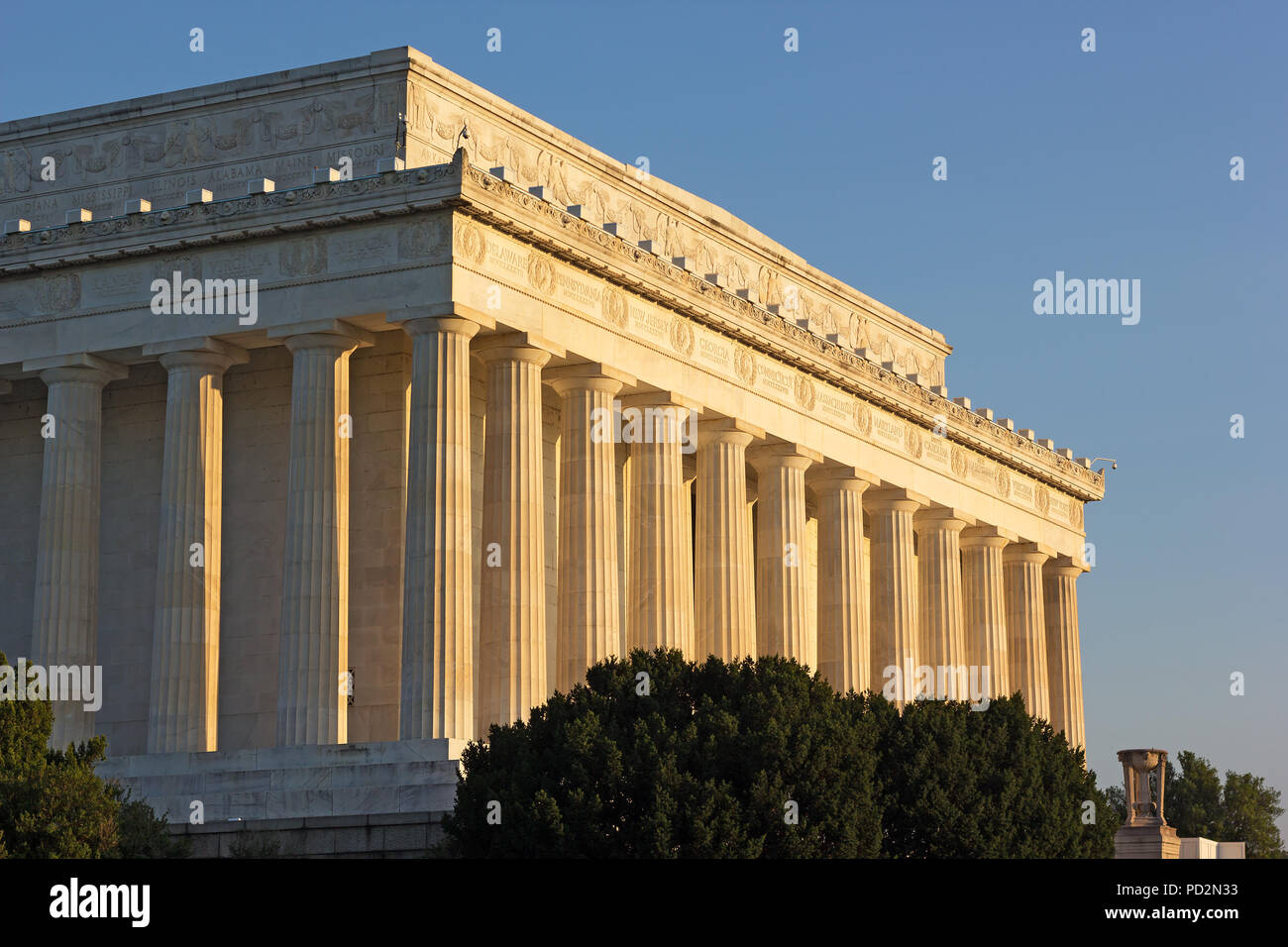 Lincoln Memorial columns illuminated by early morning sun. The ...