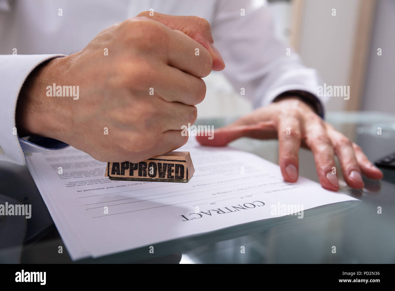Businessman's Hand Stamping Approved On Contract Paper With Stamper ...