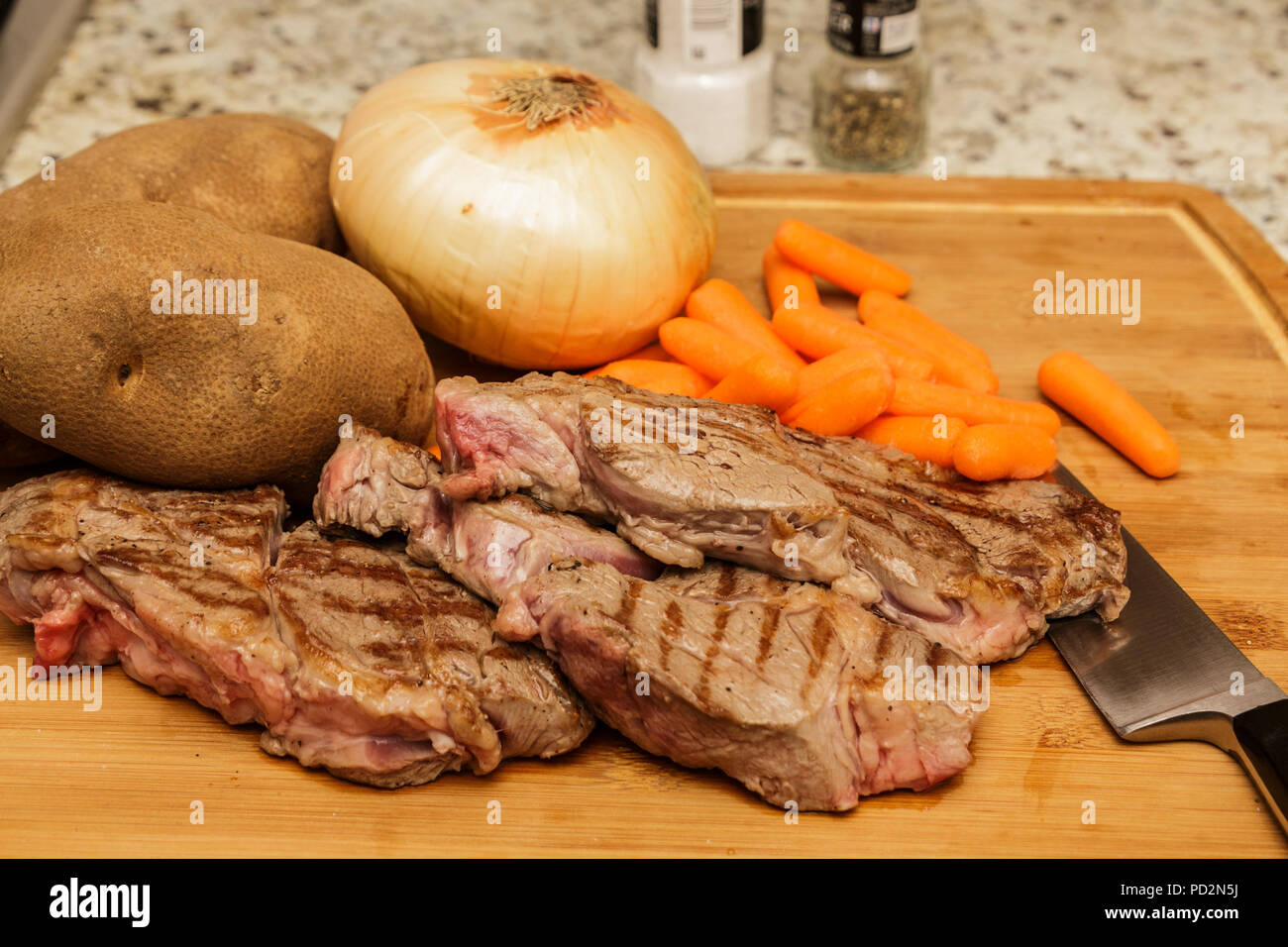Three Chuck Steaks with Vegetables Stock Photo - Alamy