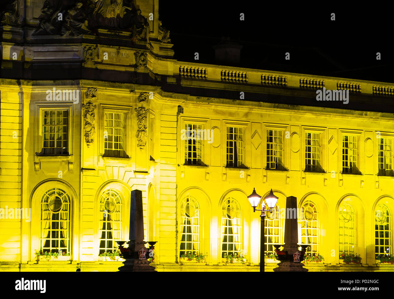 A general view of City Hall in Cardiff, Wales, UK, lit up in yellow to ...