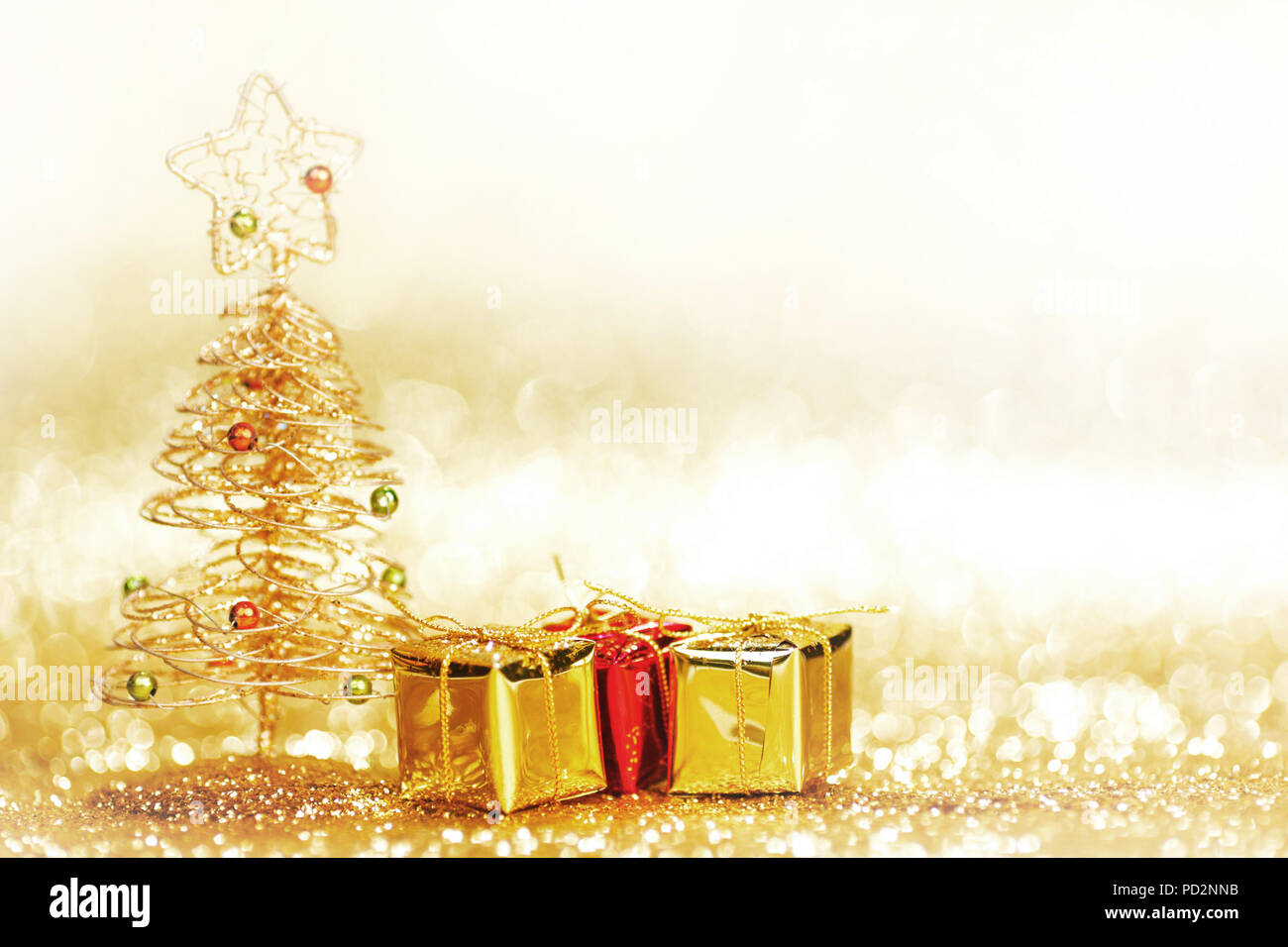 Toy golden decorative Christmas tree on glitter background Stock Photo ...