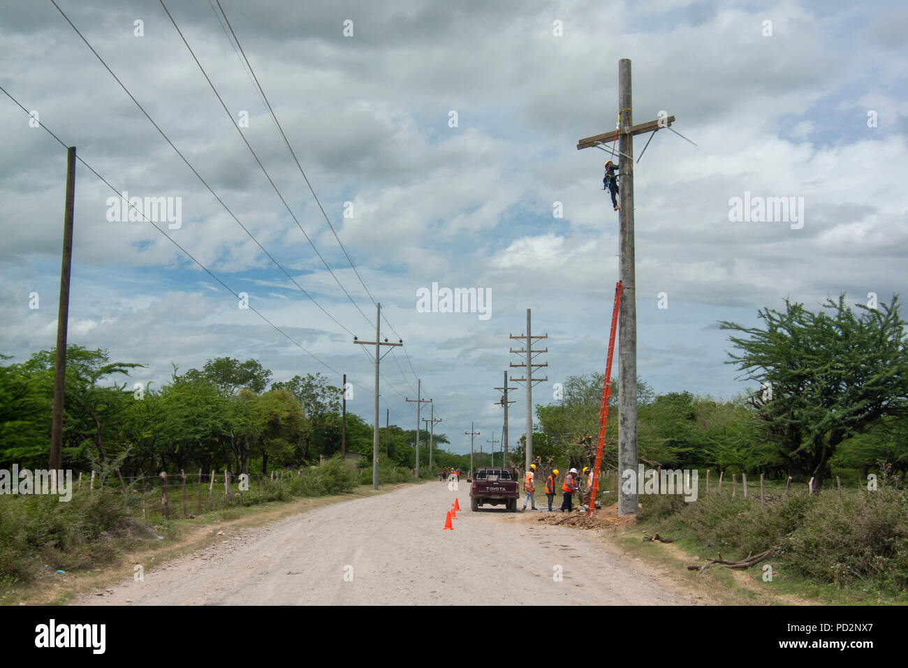 Workers working in the towers for connecting new Power Line ...