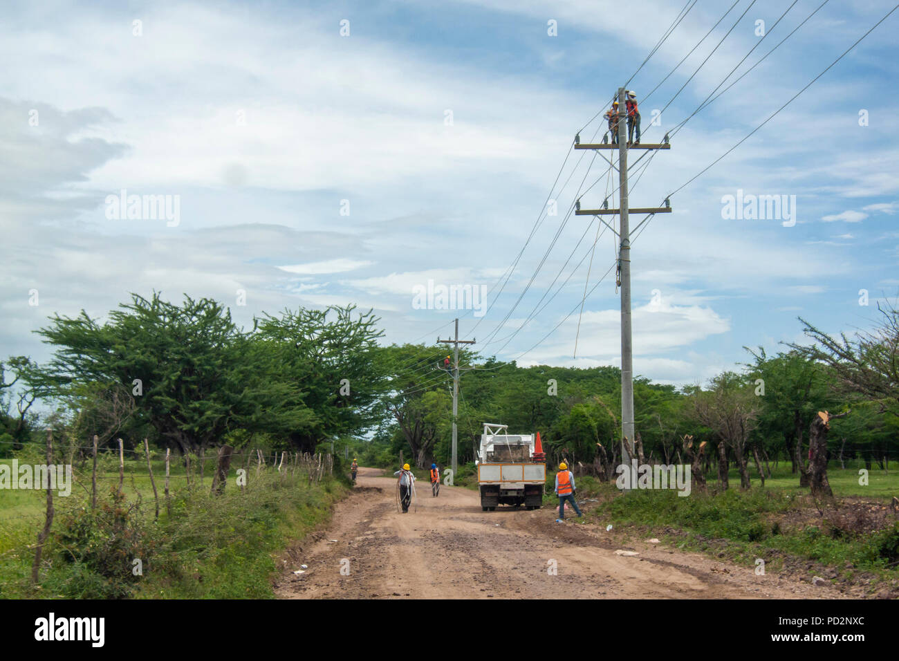 Workers working in the towers for connecting new Power Line ...