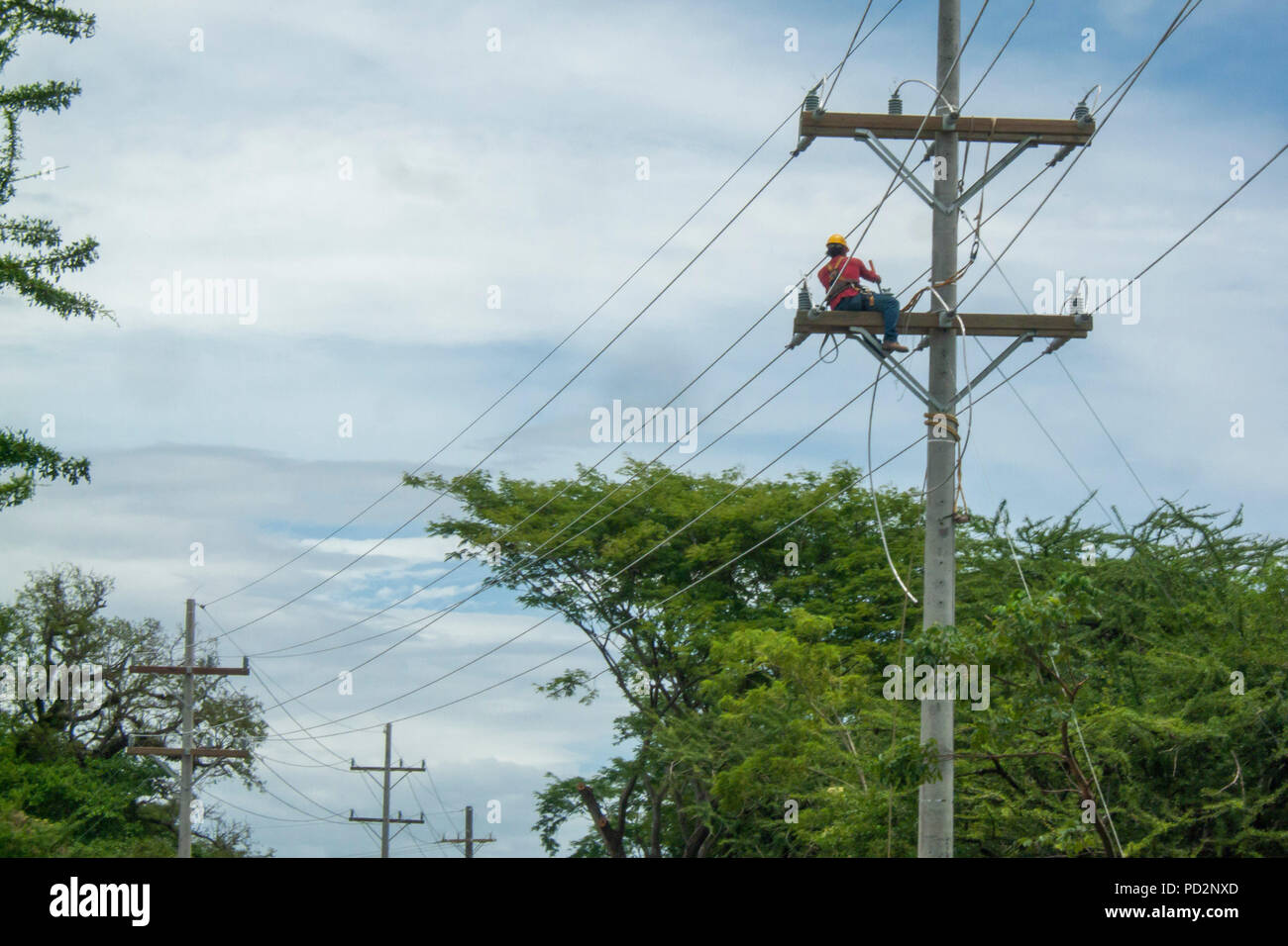 Workers working in the towers for connecting new Power Line ...