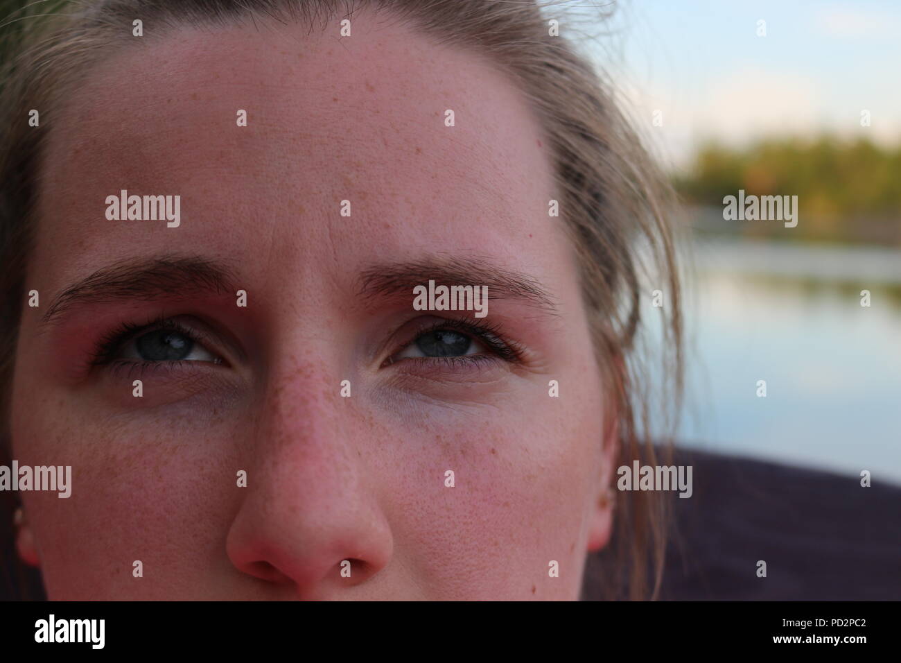 women with a curious look in her eyes with copy space on the right ...