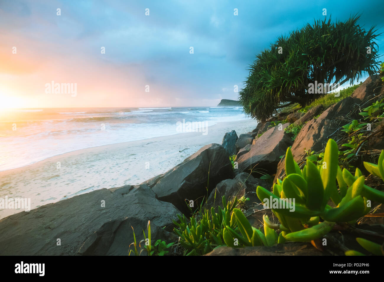 Sunrise on Seven Mile Beach Stock Photo - Alamy